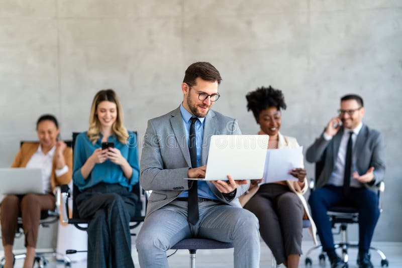 Group of Young Business People Working As a Team and Communicating in ...