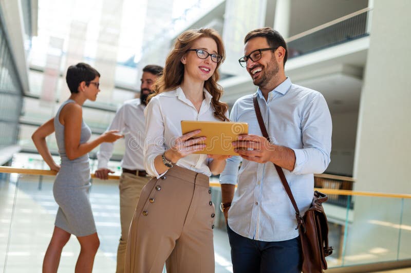 Group of Young Business People Working and Communicating at the Office ...