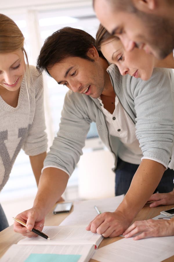 Group of Young Business People Working on a Project Stock Photo - Image ...