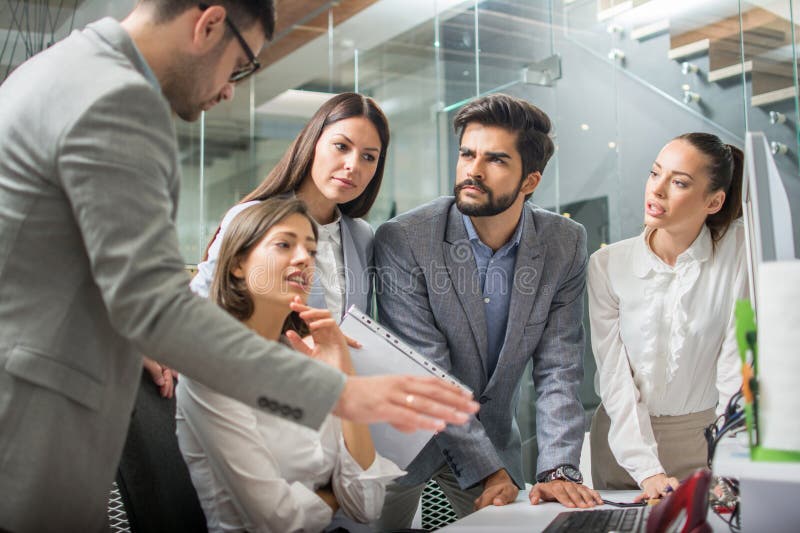 Group of Young Business People Working Together in Modern Office. Stock ... Group of Young Business People Working Together in Modern Office. Stock ...