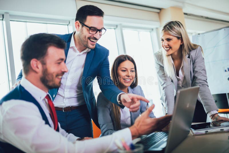 Group of Young Business People Working and Using Laptop while Sitting ...
