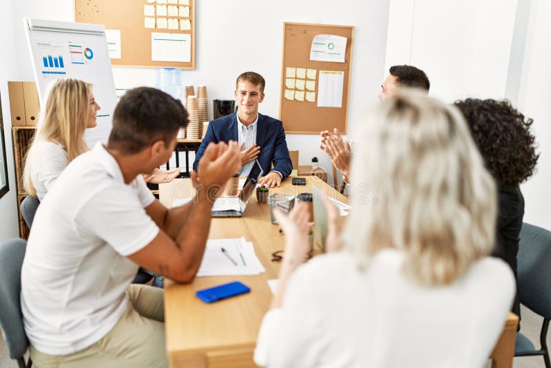 Group of Young Business Workers Smiling and Clapping To Partner at the ...