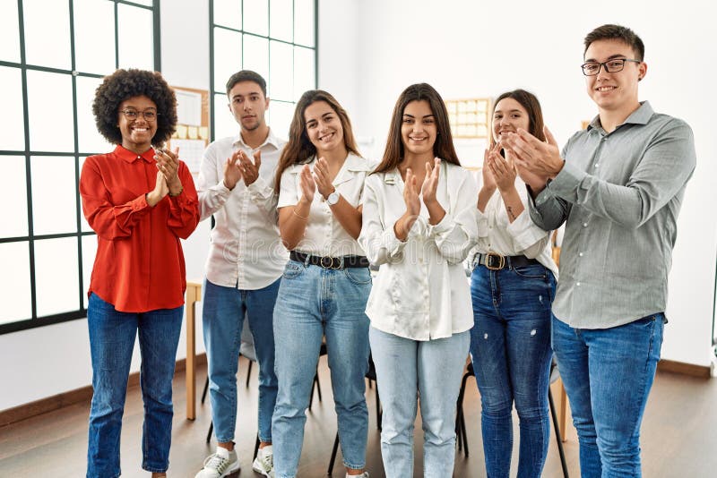 Group of Young Business Workers Smiling Happy and Clapping Stock Photo ...