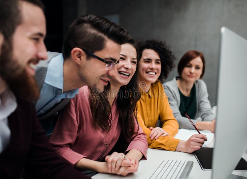 Group of Young Businesspeople Working Together in Office, Talking ...
