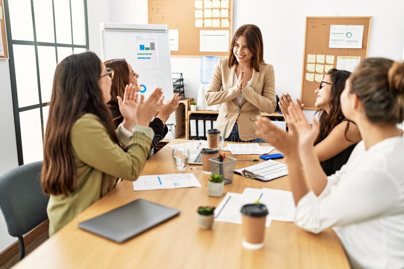 Group of Young Businesswomen Smiling and Clapping To Partner at the ...