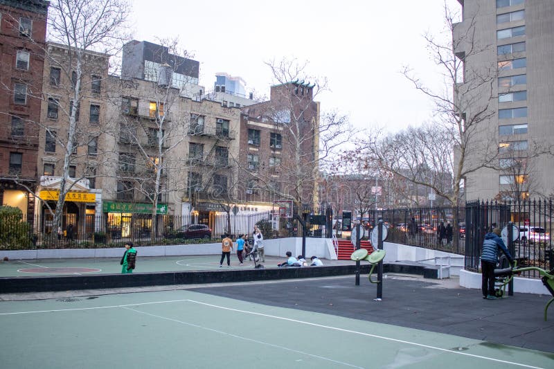 Group of Young Children Play a Competitive Game of Basketball Outdoors ... Group of Young Children Play a Competitive Game of Basketball Outdoors ...