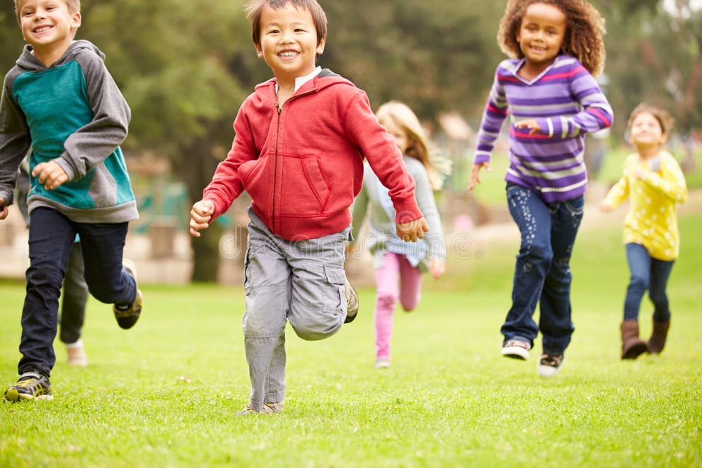 Group of Young Children Running Towards Camera in Park Stock Image ...