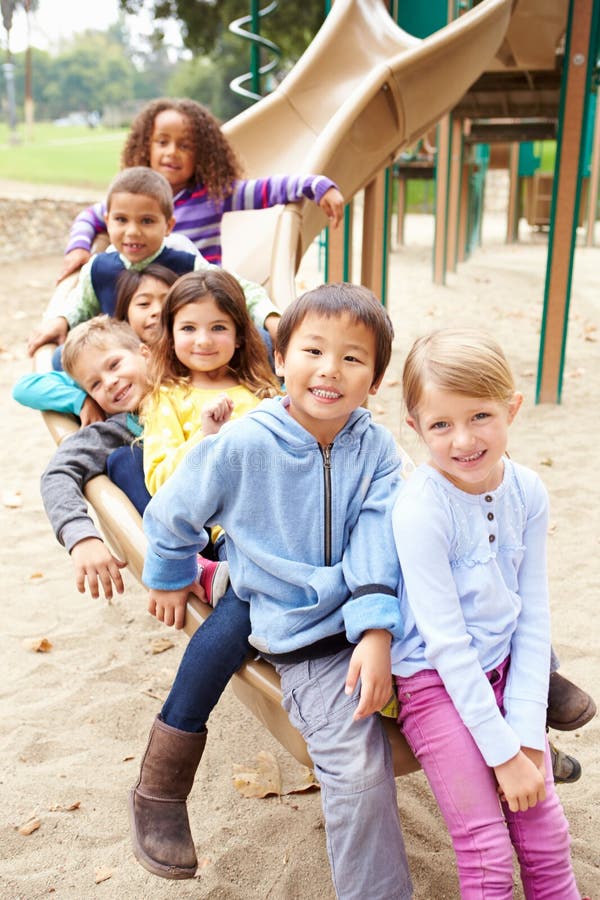 Multicultural Kids Playing On Playground