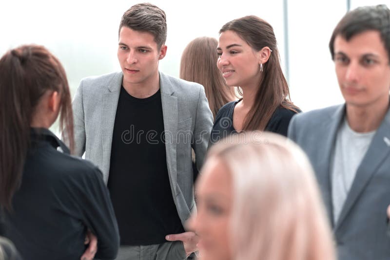 Group of Young Colleagues Talking Standing in the Office Stock Photo ...