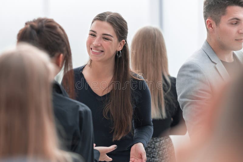 Group of Young Colleagues Talking Standing in the Office Stock Photo ...