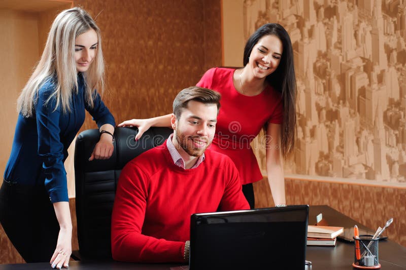 Group of Young Colleagues Using Laptop at Office Stock Image - Image of ...
