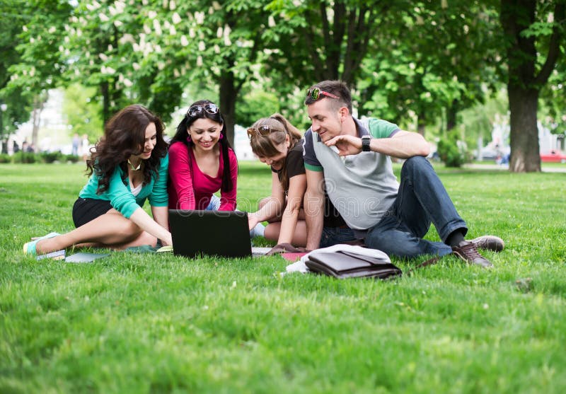 Group of Young College Students Sitting on Grass Stock Image - Image of ...