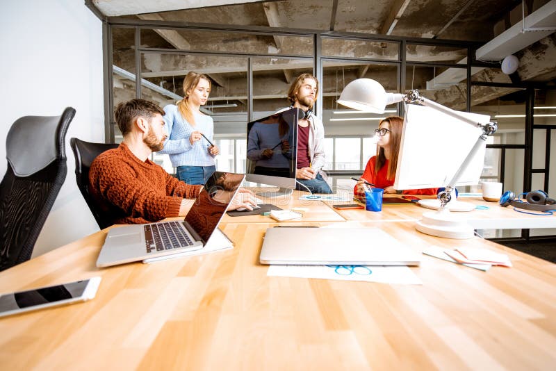 People Working Together on the Computers in the Office Stock Image ...