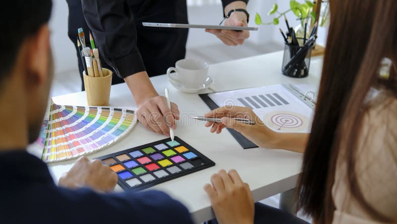 Group of Young Creative Coworkers Working with New Startup Project ...