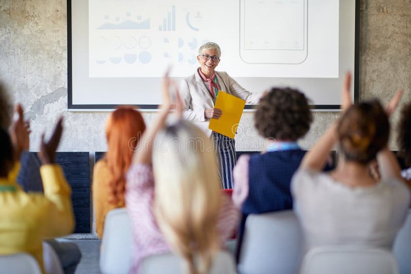 Group of Young Creative People in the Office is Clapping To a Lecture ...