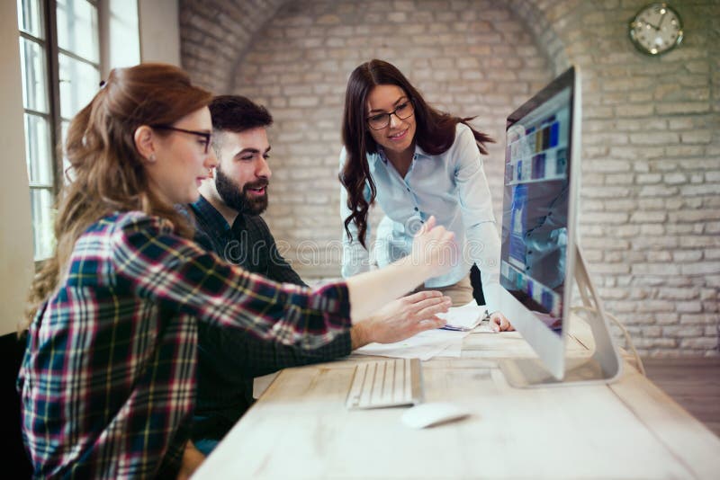 Group of Young Designers Working As Team Stock Image - Image of smile ...
