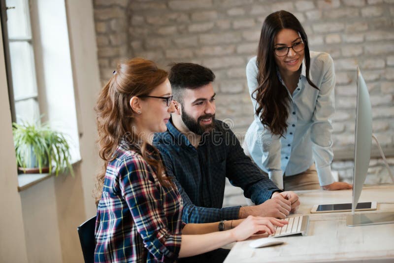 Group of Young Designers Working As Team Stock Image - Image of ...