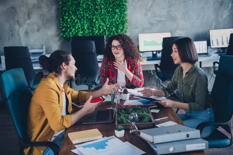 Group of Young Diverse Professionals Collaborating on a Project in a ...