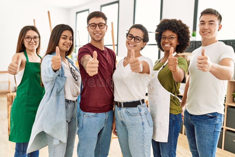 Group of Young Draw Students Smiling Happy Doing Ok Sign with Thumbs Up ...