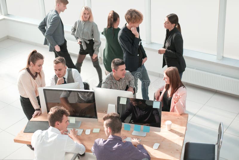 Group of Young Employees Discussing Work Issues Stock Image - Image of ...