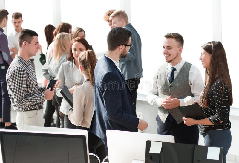 Group of Young Employees Discussing Work Issues Stock Image - Image of ...