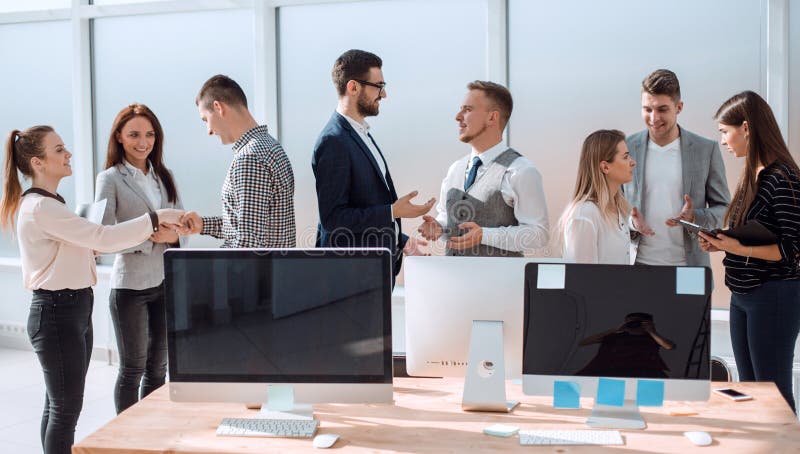 Group of Young Employees Discussing Work Issues Stock Photo - Image of ...