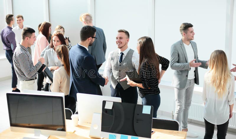Group of Young Employees Discussing Work Issues Stock Image - Image of ...