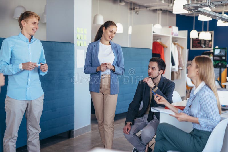 Group of Young Employees Gathered To Discuss Work Issues Stock Photo ...