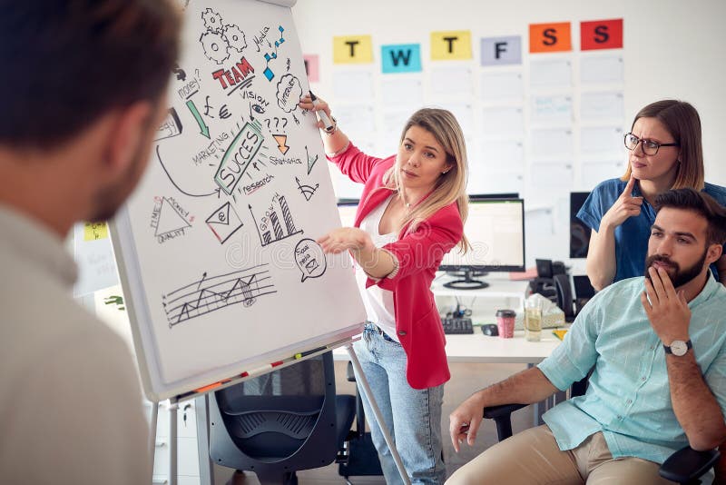 A Group of Young Employees is Having a Conversation at a Meeting in the ...