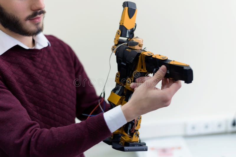 Group of Young Engineers Working on Robotics Project. Scientist ...