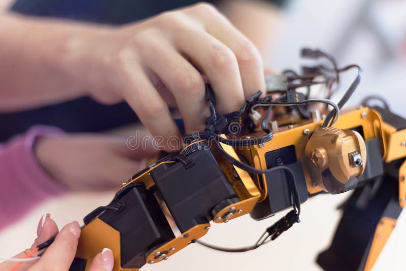 Group of Young Engineers Working on Robotics Project. Scientist ...