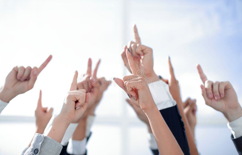 Group of Young Entrepreneurs Pointing Up To a Copy of the Space Stock ...