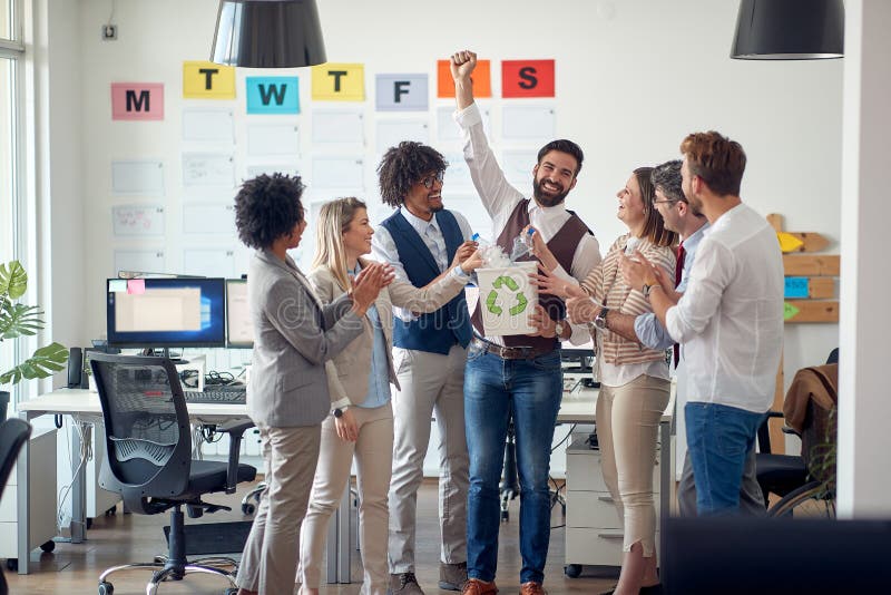 Group of Young Environmentally Focused Employees Recycling Together ...