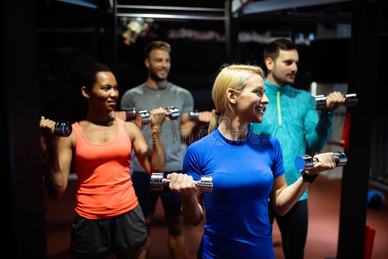Group of Young Friends People Doing Exercises in Gym Stock Image ...