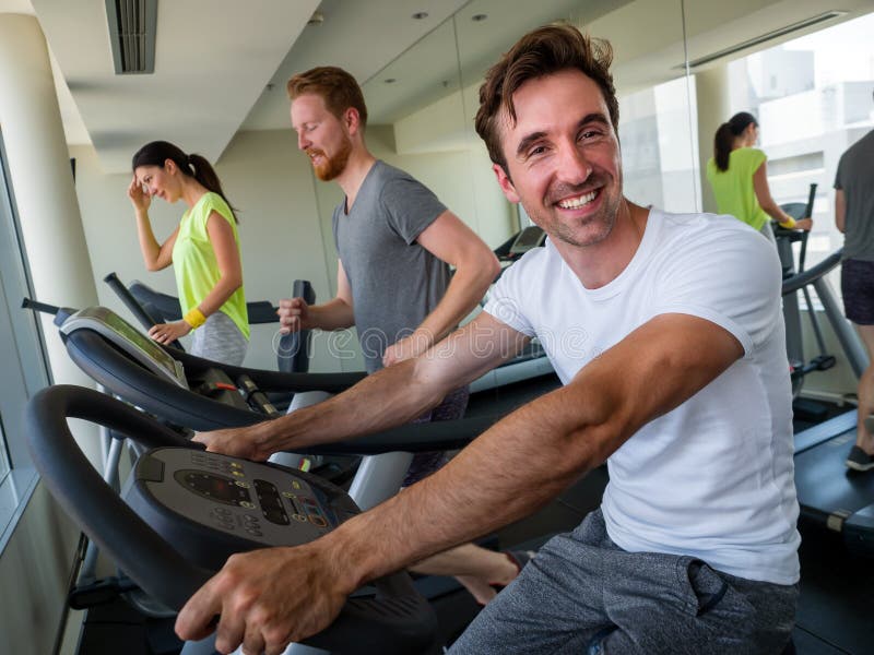 Group of Young Friends Doing Exercises in Gym Stock Photo - Image of ...