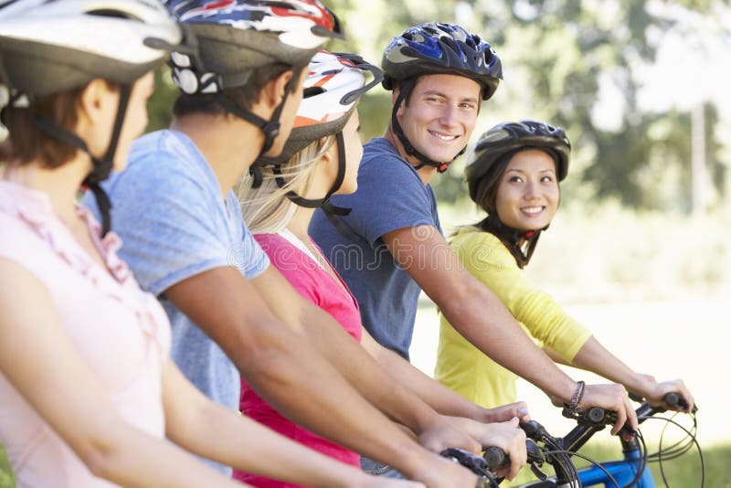 Group of Young Friends on Cycle Ride in Countryside Stock Photo - Image ...