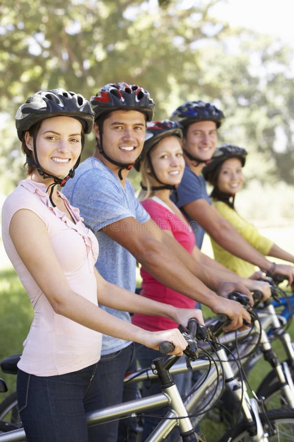Group of Young Friends on Cycle Ride in Countryside Stock Photo - Image ...