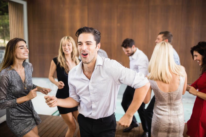 Group of Young Friends Dancing Stock Photo - Image of indoors ...