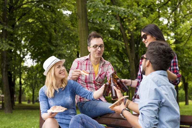 Group of Young Friends Drinking Beer and Having Fun on a Park Bench ...