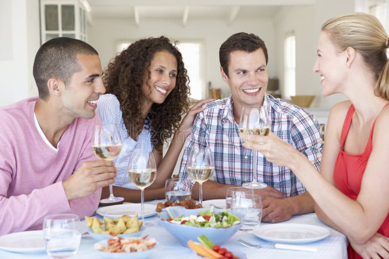 Group of Young Friends Eating Meal at Home Stock Image - Image of ...
