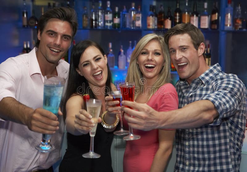 Group of Young Friends Enjoying Drink in Bar Stock Image - Image of ...