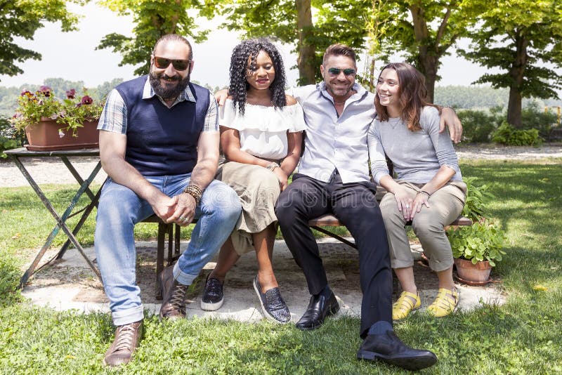 Group of Young Friends Have Fun Sitting on a Bench Stock Photo - Image ...