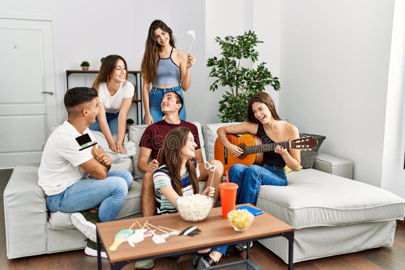 Group of Young Friends Having Party Playing Classical Guitar at Home ...