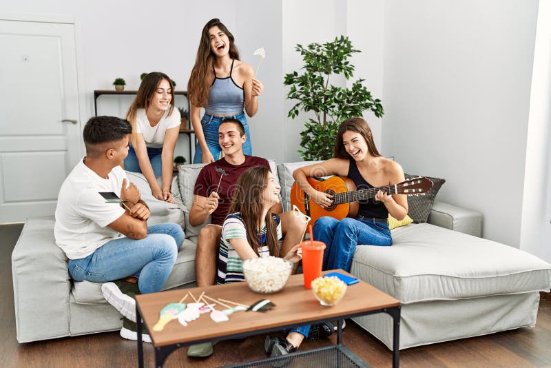 Group of Young Friends Having Party Playing Classical Guitar at Home ...