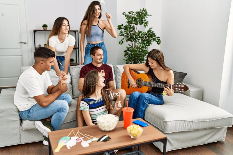 Group of Young Friends Having Party Playing Classical Guitar at Home ...