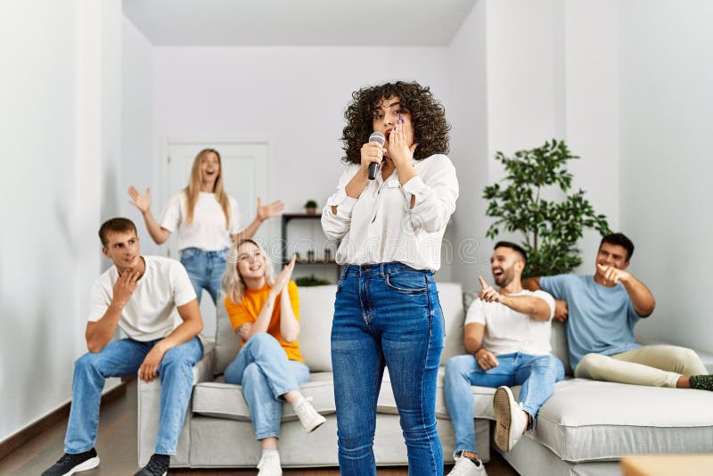 Group of Young Friends Having Party Singing Song Using Microphone at ...