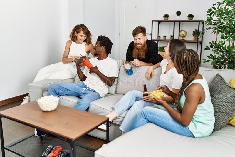 Group of Young Friends Having Party Sitting on the Sofa at Home Stock ...