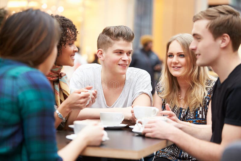 Group of Young Friends Meeting in Cafe Stock Image - Image of caucasian ...