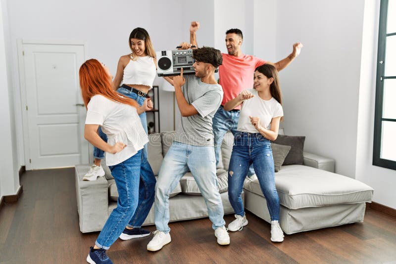 Group of Young Friends Smiling Happy and Dancing at Home Stock Photo ...