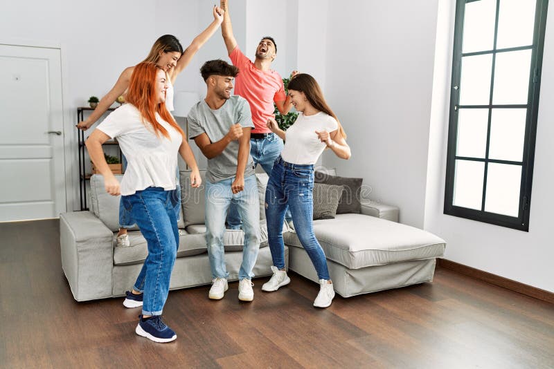 Group of Young Friends Smiling Happy and Dancing at Home Stock Photo ...